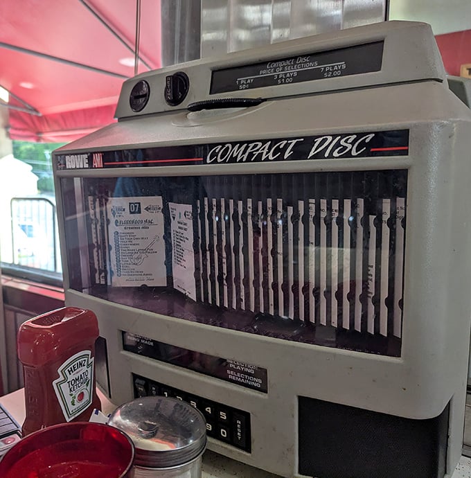 The vintage jukebox stands as a time capsule of musical memories, ready to provide the soundtrack to your comfort food experience.