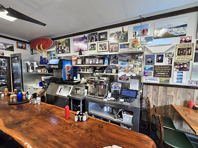 The counter view—where magic happens. Photos of surf legends watch over the preparation of countless breakfast classics, a shrine to both sport and sustenance.