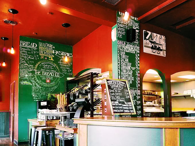 Where the magic happens—chalkboard menus and fresh-baked treasures await behind the counter. This is the control room of carb paradise.