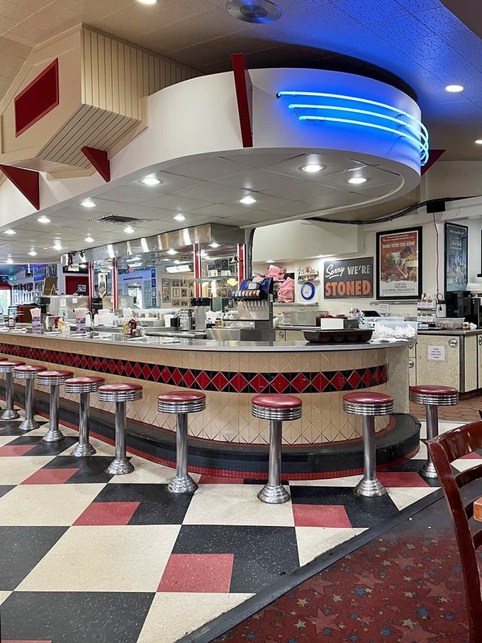 The counter isn't just where orders are taken—it's front-row seating to the greatest show in town. Those stools have witnessed more first dates than a movie theater.