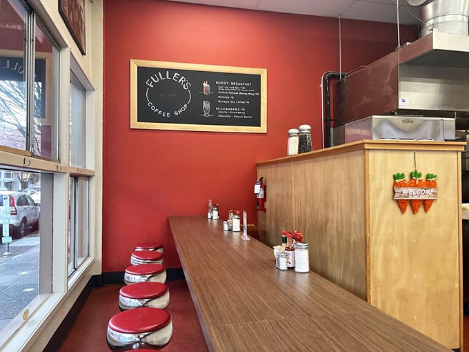 Red counter stools waiting for the morning rush like patient sentinels. Each one has heard thousands of Portland stories.