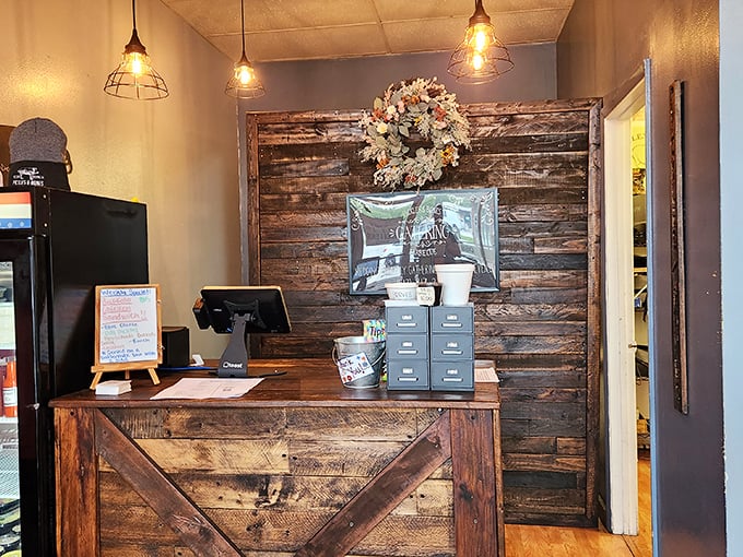 Rustic meets refined at this wooden check-in counter. The barn-wood aesthetic isn't just for show—it's setting the stage for the primal pleasure of great barbecue.