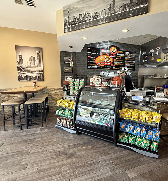 The counter area showcases Chicago skyline art and chip racks – because sometimes you need a little something extra with your sandwich.