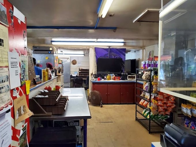 The ordering counter at Jake's—where BBQ dreams are born and hunger goes to surrender. No fancy digital displays, just human connection and meat magic.