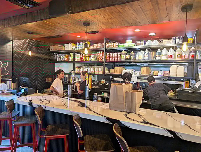 The bustling counter where barbecue dreams come true—watch as your order comes together with all the anticipation of Christmas morning.