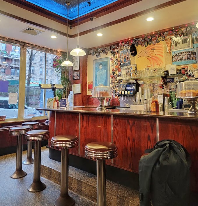 The counter at Tom's—where solo diners find community, coffee cups are never empty, and the stools have heard every New York story worth telling.