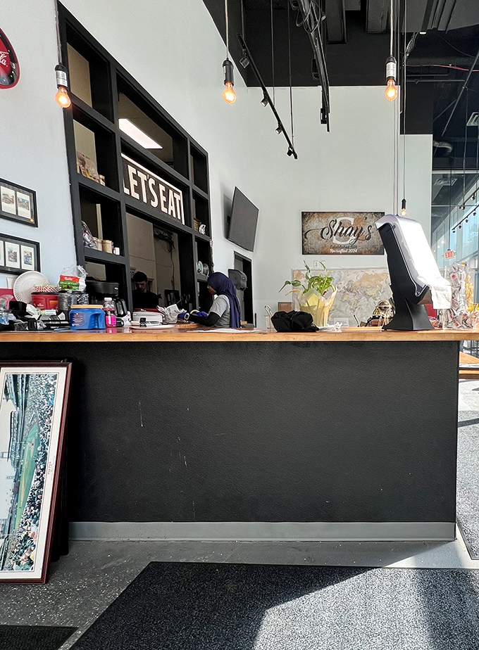 Where sandwich magic happens. The "LET'S EAT" sign isn't just decoration—it's the most sensible advice you'll receive all day.