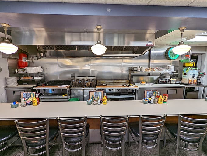 The open kitchen counter—where culinary theater happens daily. Front-row seats to the sizzle and flip show that's been running for decades.