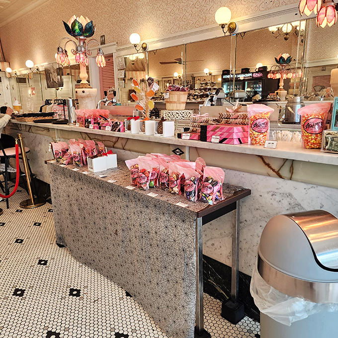 Pink bags and boxes lined up like sweet soldiers awaiting deployment. These take-home treasures transform ordinary days into celebrations.