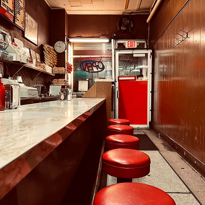 These red stools have supported generations of Detroiters, each one a front-row seat to the timeless performance of short-order cooking.