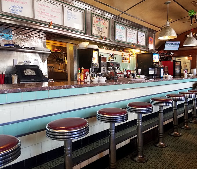 These red-topped stools have witnessed countless conversations, confessions, and coffee refills—silent sentinels of diner history in Laconia.