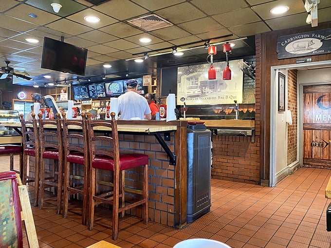 The counter seats—where barbecue aficionados perch to watch the masters at work, like front-row tickets to the most delicious show in Alabama. 