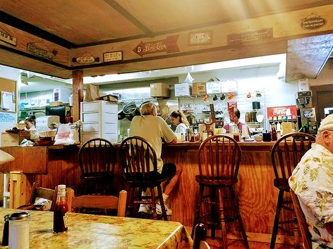 The counter seats—where regulars become family and the kitchen's symphony plays out before your eyes. Front-row tickets to breakfast theater.