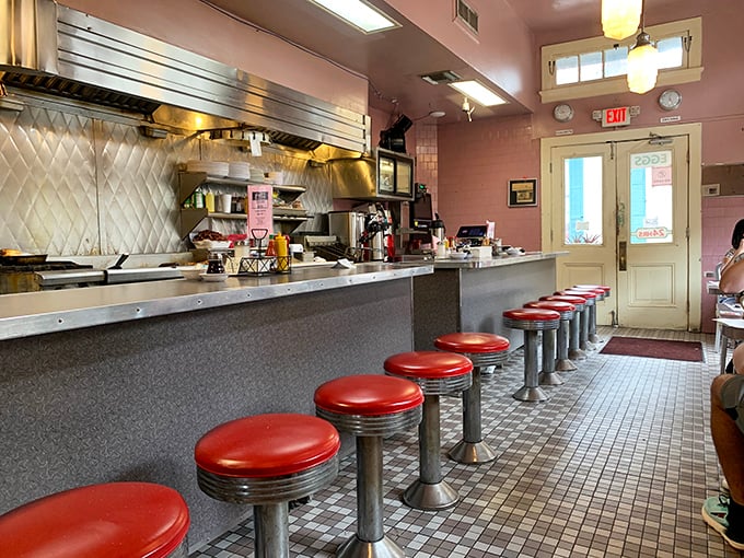The counter view: where red stools await and every seat offers a front-row ticket to the short-order show that's been running for decades.