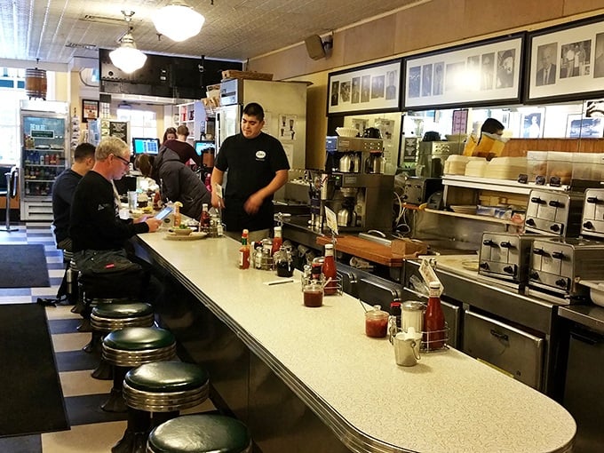 The counter seating—where solo diners become temporary family and the coffee refills flow like conversation. Some of life's best moments happen on these stools.