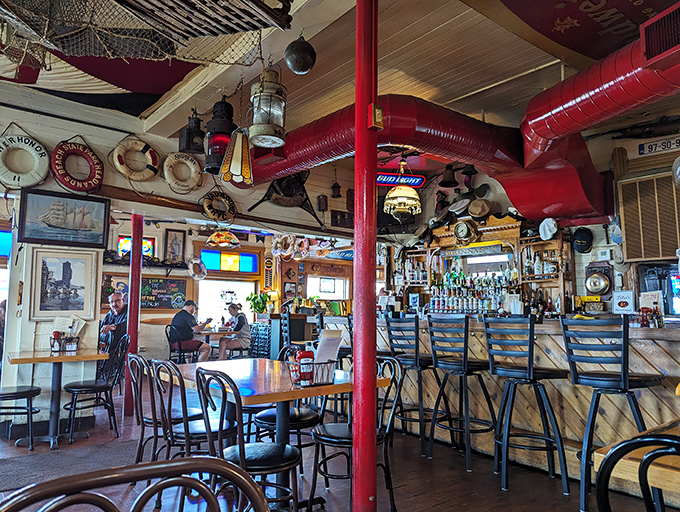 The ceiling at Brennan's isn't just decorated – it's curated with decades of maritime treasures that could keep conversation flowing longer than the Grand River itself.