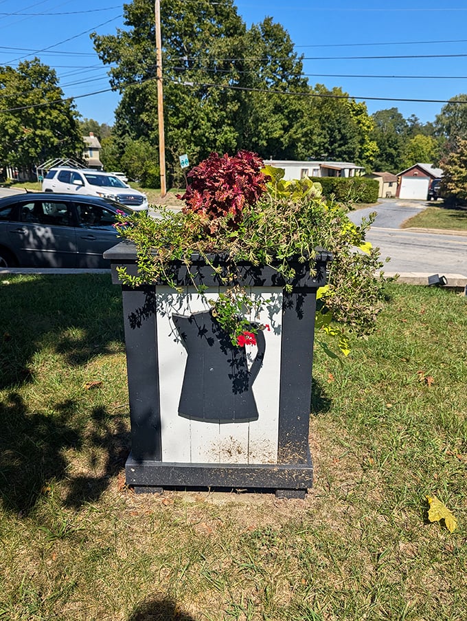 This charming planter proves the coffee theme runs deep—even the landscaping pays homage to the building's perky personality.