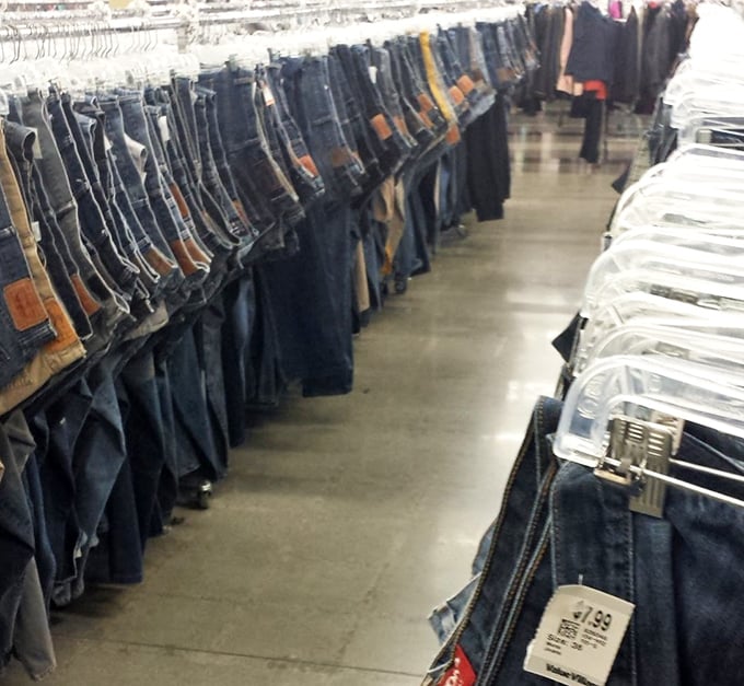 Denim alley—where jeans of every era hang in silent testimony to America's enduring love affair with sturdy pants and changing waistlines.
