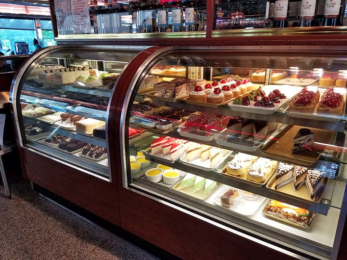 A rotating display case of desserts that makes willpower vanish faster than your uncle's hairline – resistance is futile.