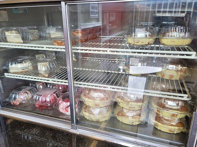 The dessert case—where sweet temptations await after your savory seafood adventure. Each container holds a different path to happiness.
