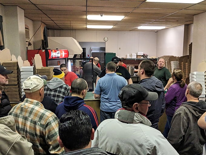 The line forms for a reason. These pizza pilgrims know that good things come to those who wait—especially when it's legendary Beaver County-style pizza.