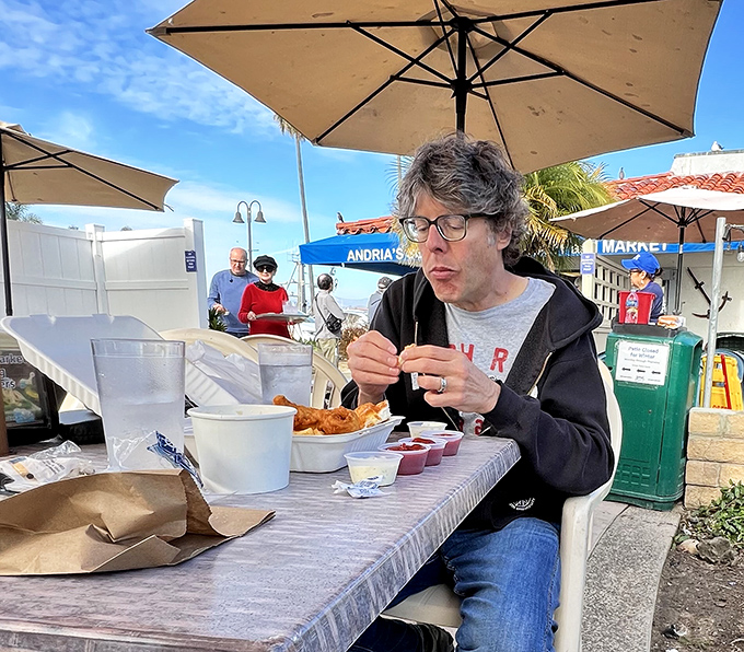 A diner enjoying the outdoor feast—that look of concentration says it all. Some meals deserve your complete attention.