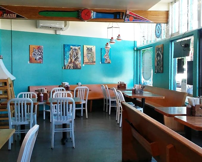 Bright turquoise walls showcase local art while wooden tables invite lingering conversations over coffee refills and second helpings.