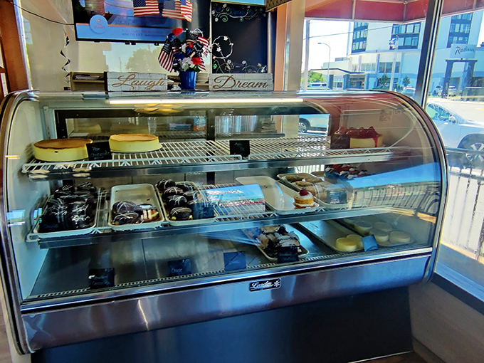 The dessert case—where willpower goes to die and "I'll just have a bite" becomes the lie we tell ourselves.