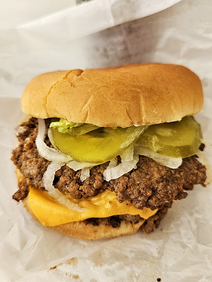 A double cheeseburger with pickles and onions that makes fancy $20 gourmet versions seem like they're trying too hard.