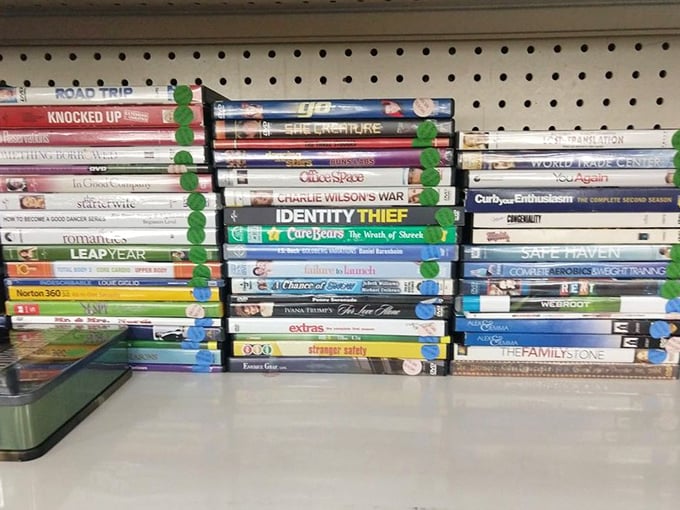 DVDs stacked like a Blockbuster time capsule – remember when Friday night meant actual video store trips?