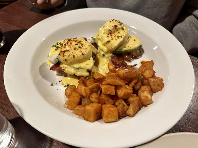 Their Eggs Benedict performs a perfect balancing act – creamy hollandaise, perfectly poached eggs, and those home fries that deserve their own fan club.