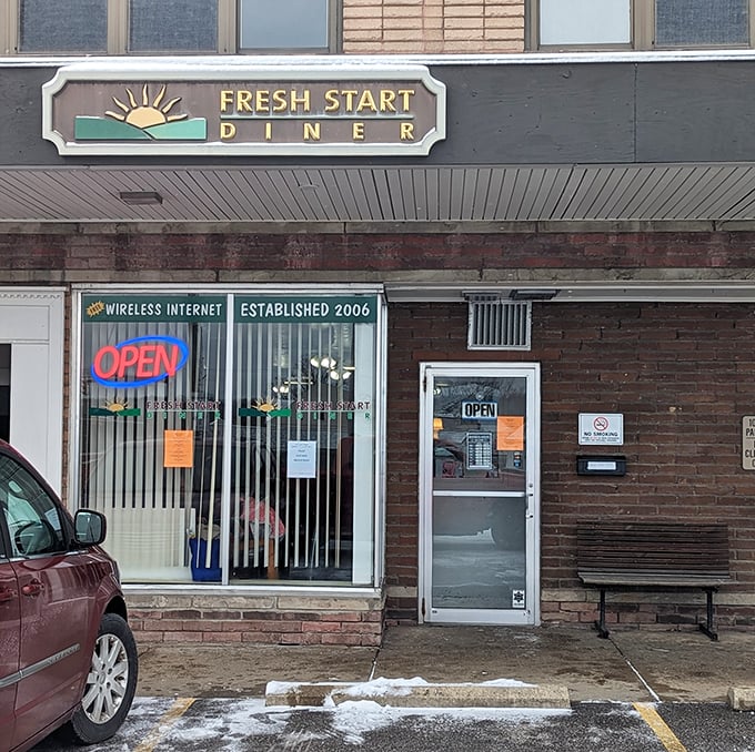 The "OPEN" sign – three magical neon letters that translate to "Yes, we will make you breakfast at 11am on a Tuesday."