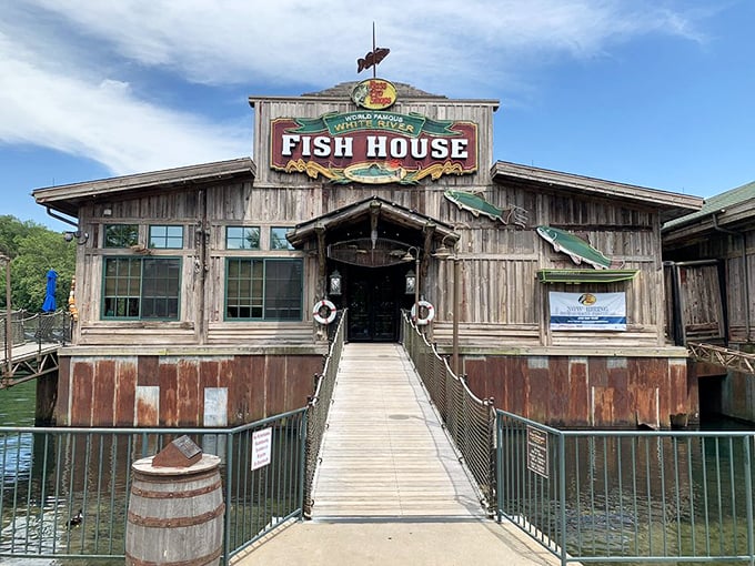 The entrance walkway isn't just a path to dinner—it's a wooden runway to seafood nirvana. That weathered sign promises delicious adventures ahead.