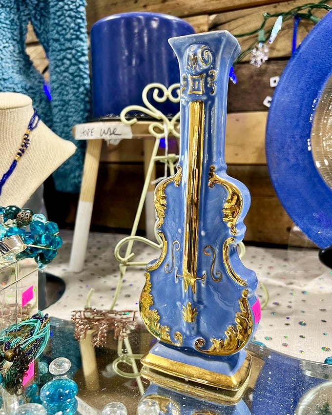 This blue and gold violin vase isn't just decorative – it's the conversation piece your mantel has been desperately waiting for.