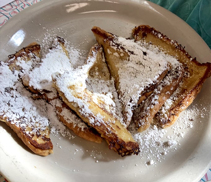 French toast that makes you question all other breakfasts you've ever had. Dusted with powdered sugar and waiting to soak up maple syrup like a sweet, carby sponge.