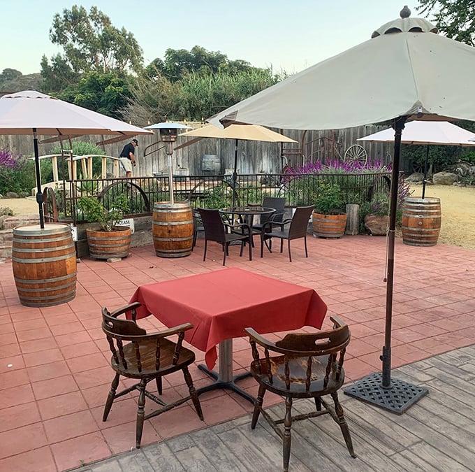 The outdoor patio offers al fresco dining California-style—where wine barrels and garden views create the perfect backdrop for carnivorous indulgence.