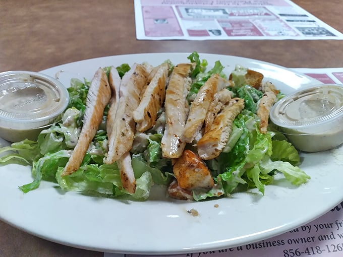A grilled chicken salad for when you want to pretend you're being healthy. The dressing comes on the side – a nod to restraint.