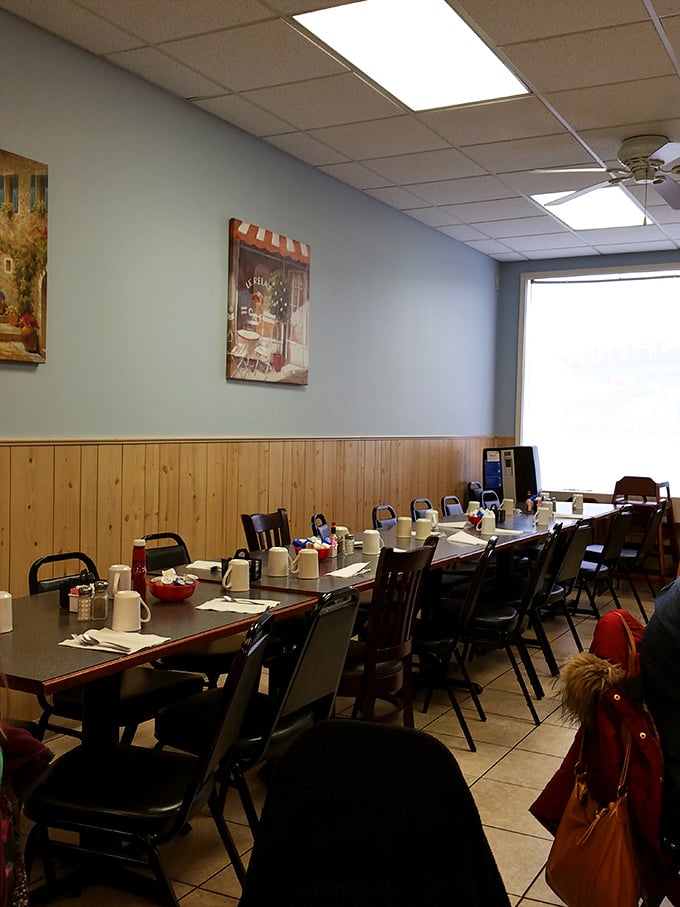 The community table—where coffee cups await early risers and conversations flow as freely as the bottomless refills.