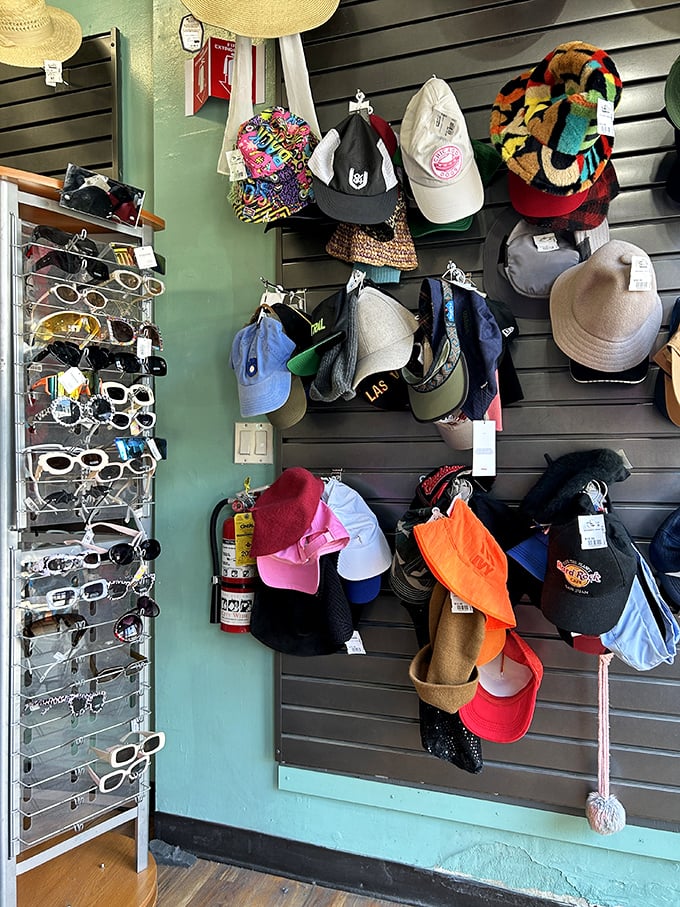 The accessories wall—where vintage sunglasses and statement hats wait to complete your look or launch your next costume party triumph.