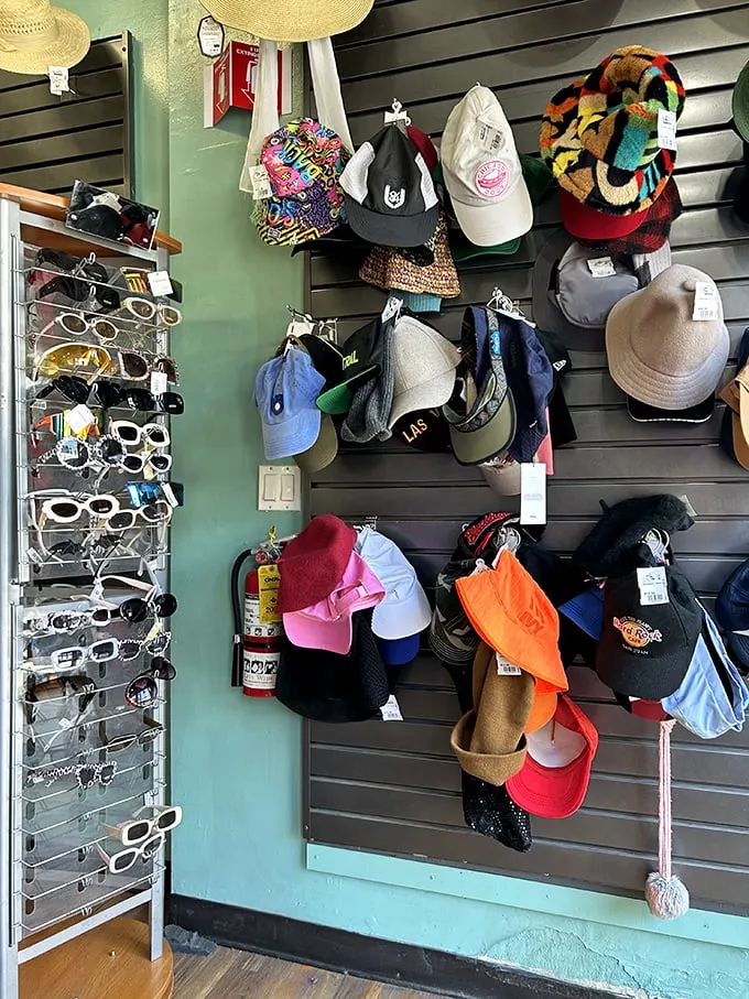 The accessories wall—where vintage sunglasses and statement hats wait to complete your look or launch your next costume party triumph.