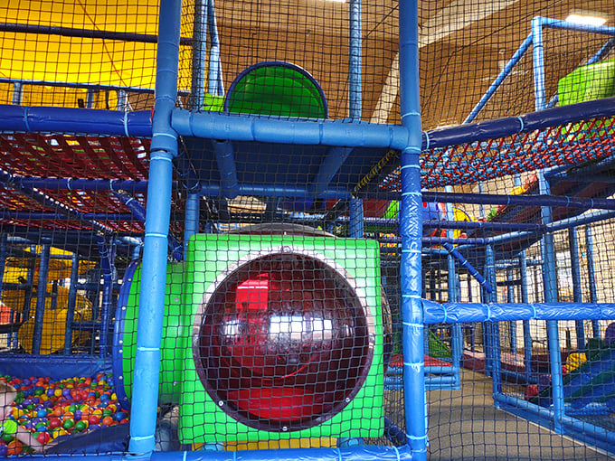This isn't just a playground—it's a colorful labyrinth where kids burn energy while parents silently thank the genius who invented indoor play areas.