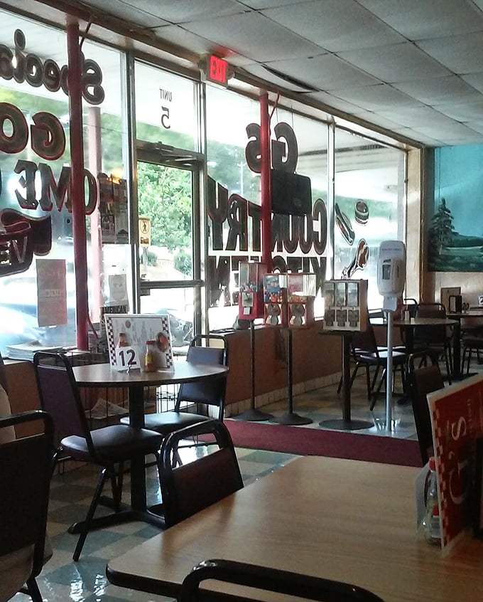 Sunlight streams through windows bearing the restaurant's name – a beacon for hungry travelers seeking authentic Southern cooking in Huntsville.