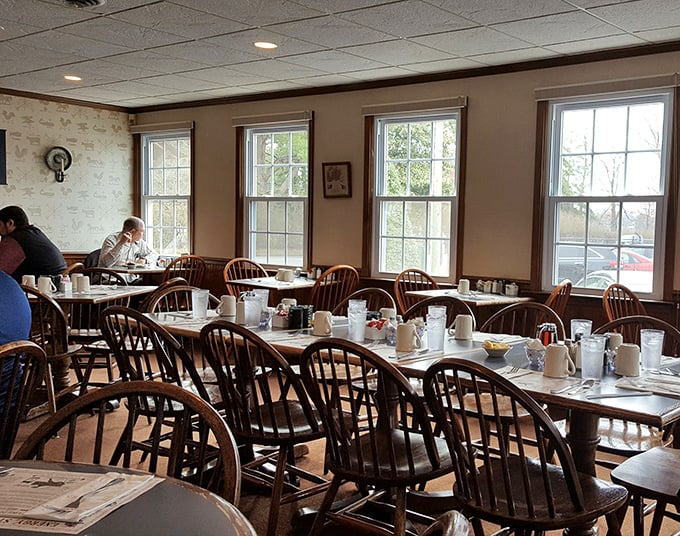 Another dining area bathed in natural light, where Windsor chairs have supported generations of satisfied breakfast enthusiasts and Sunday paper readers.