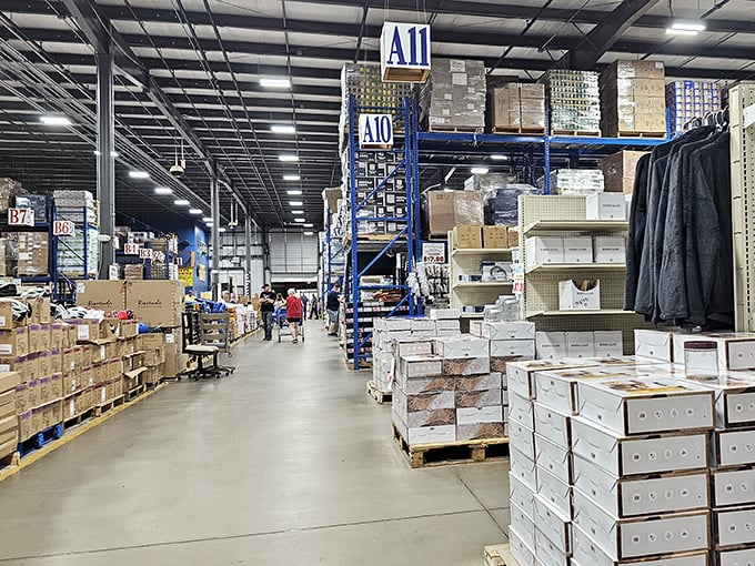 The warehouse perspective that makes shoppers feel like they've entered retail Narnia. Those blue shelving units reach toward heaven, or at least toward more incredible deals.