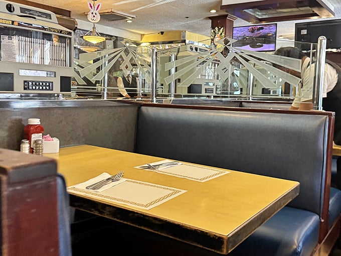 Classic booth dividers with etched glass—the kind of thoughtful design detail that separates a true diner from mere restaurants. Privacy with a side of pancakes.