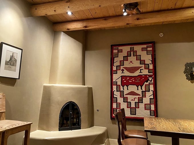 That kiva fireplace and Southwestern textile aren't just decoration—they're a warm embrace from New Mexico itself, saying "stay awhile, friend."