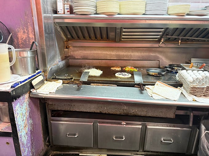 Where the magic happens—a well-seasoned flat top that holds decades of delicious secrets. No fancy equipment needed.