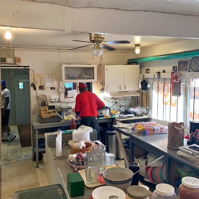 Behind the scenes in the kitchen, where barbecue magic happens without fanfare or fuss – just dedication to a craft perfected over decades.