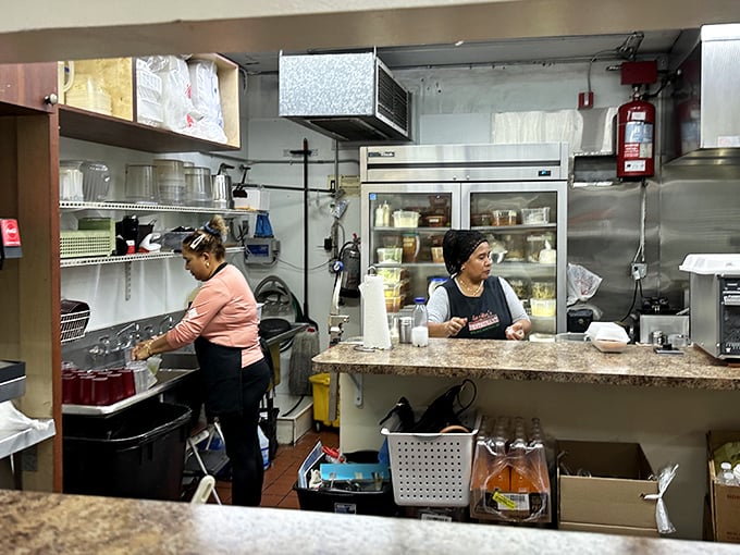 In the kitchen, skilled hands work with practiced precision – decades of culinary tradition translated into each dish that makes its way to your table.