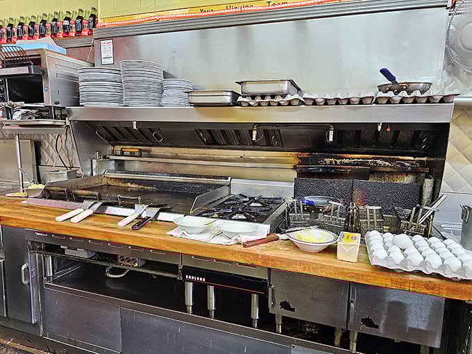 Behind the scenes, the kitchen's organized chaos reveals the ballet of short-order cooking in all its sizzling glory.